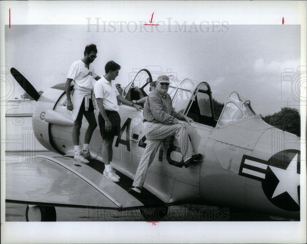 1994 Press Photo Neal Shine swing into AT6 fighter - DFPD71107 ...
