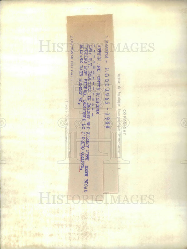 Press Photo T.V. Ensemble in bright red jersey with Broad flying Bat ...
