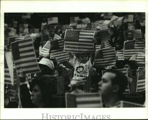 1991 Press Photo Citizens Holding Up Flags at Event, Alabama - Historic ...