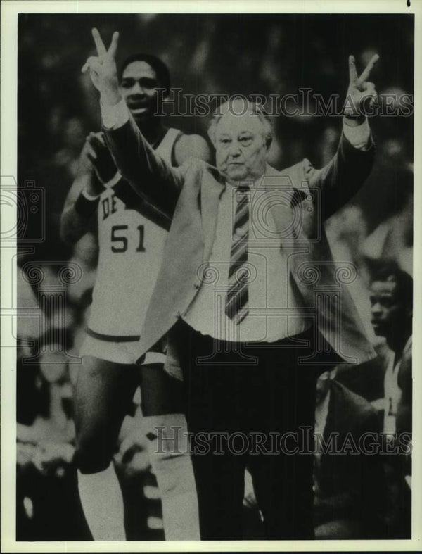 1984 Press Photo DePaul basketball coach Ray Meyer raises arms during ...