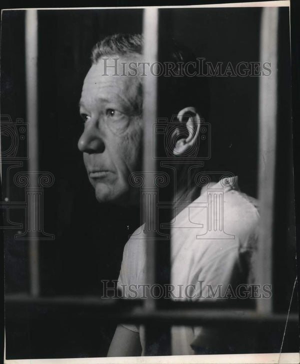 1959 Press Photo Joseph F. Selby, Houston accountant, sits behind bars ...