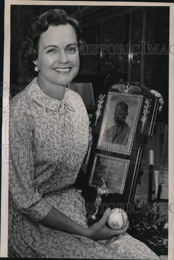 1961 Press Photo Mrs. Gabe Paul unpacks husband's trophies. - hps13422 ...