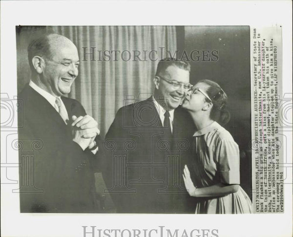 1961 Press Photo Dean Rusk grins as Joseph Satterthwaite kissed by ...