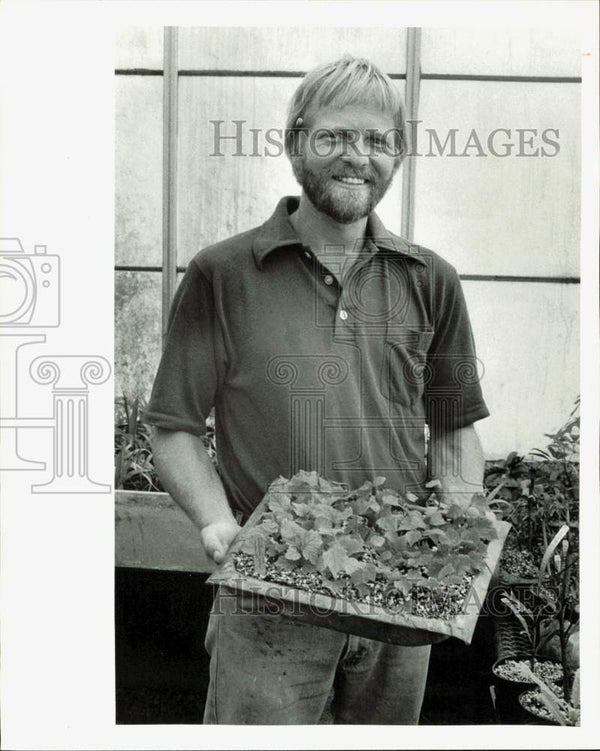 Press Photo Jonathan Foote showing his plants in garden greenhouse ...
