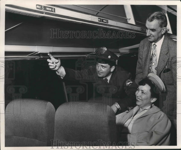 1953 Press Photo Greyhound bus driver demonstrating interior of bus ...