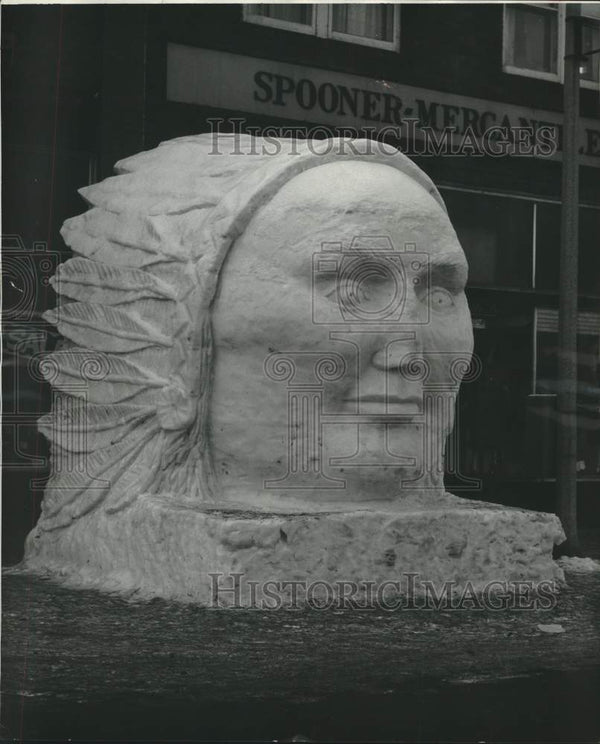 1956 Press Photo Snow sculpture of native american head by Joe Barta ...