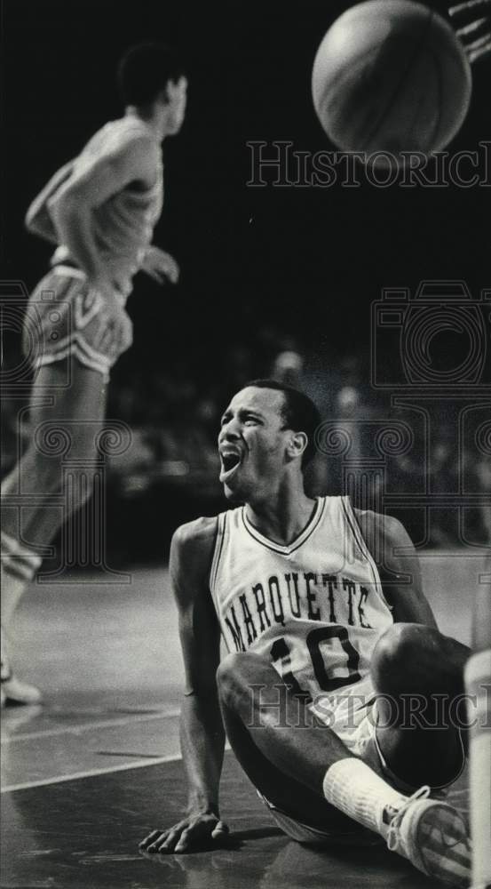 1982 Press Photo Marquette player Michael Wilson falls on court at ...