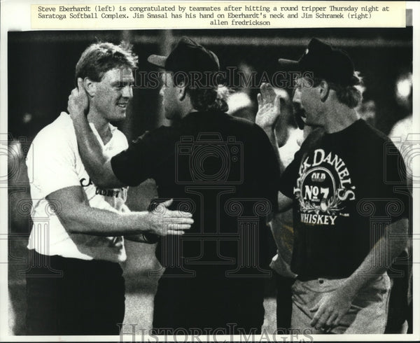 1990 Press Photo Steve Eberhardt congratulated by teammates after runs ...