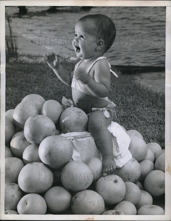 1959 Press Photo Little Julie Ann Pope sits atop succulent sample of g ...