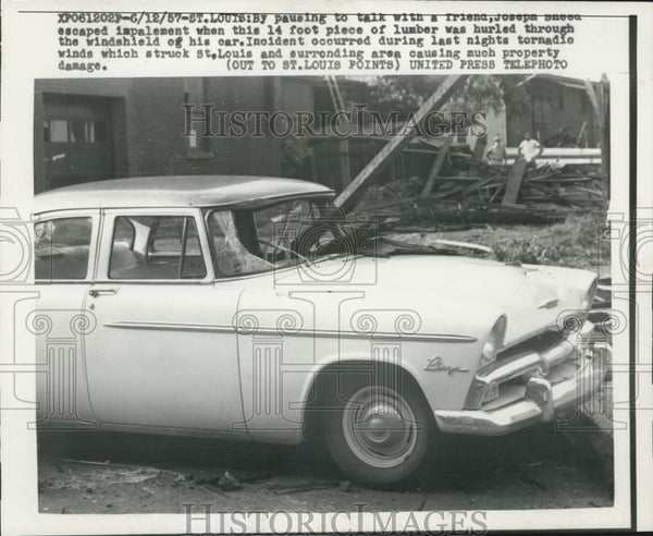 1957 Press Photo Plank of wood hurled through car windshield during a ...