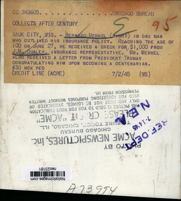 1945 Press Photo Bernard Merkel Receives Early Insurance Check from J.M ...