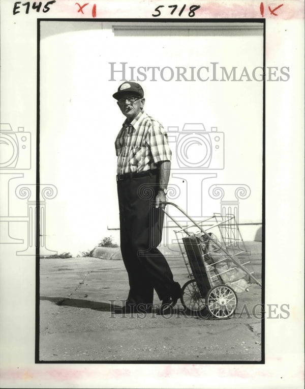 1987 Press Photo Not What It Used To Be E. Becnel makes his way down ...