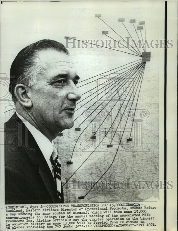 1971 Press Photo Charlie Buckland of Eastern Airlines shown with route ...