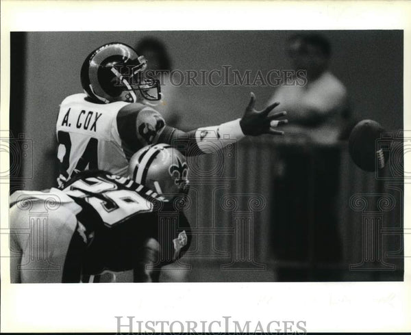 1988 Press Photo Footballer Reggie Sutton breaks up pass in endzone to ...