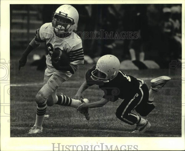 1984 Press Photo Harvey Saint football running back Shombe Boston ...