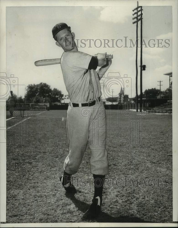 Press Photo Baseball player J W Porter swings bat in practice on the ...
