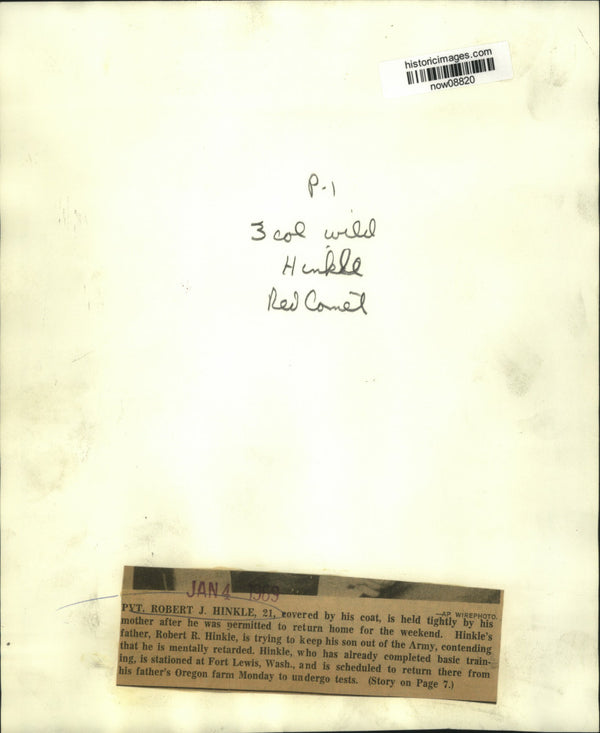 1969 Press Photo Pvt. Hinkle covered by coat, held by his mother in ...