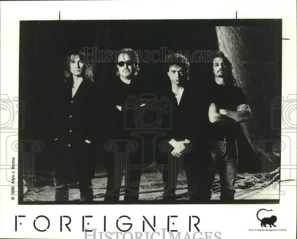 1995 Press Photo Four Members of the band Foreigner stand for portrait ...