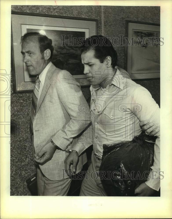1983 Press Photo Boxer Tony Ayala Jr. handcuffed at an airport ...