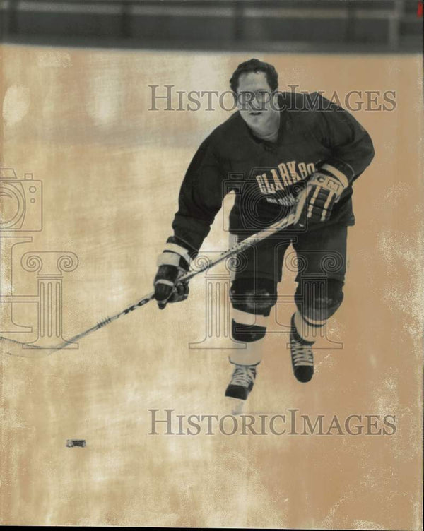 Press Photo Clarkson's hockey player Gary Mike moves puck on the ice ...
