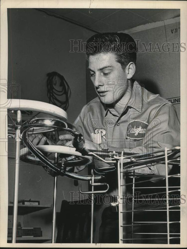 1965 Press Photo School dropouts.Unnamed young man working on baby ...