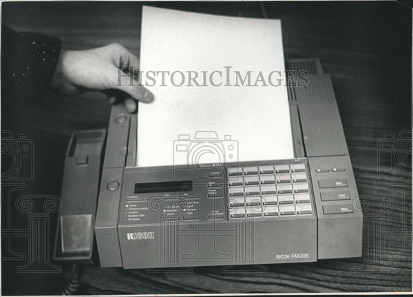 Person Holding a Piece of Paper to the Fax Machine, 1989 vintage press ...