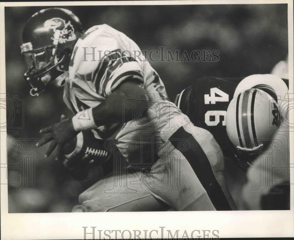 Auburn's Tim Garner Attempts Tackling Running Kansas' Jay Litteken ...