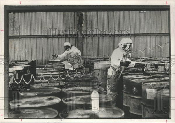 Alabama-Workers at Emelle's Chemical Waste Dump examine barrels, 1989 ...