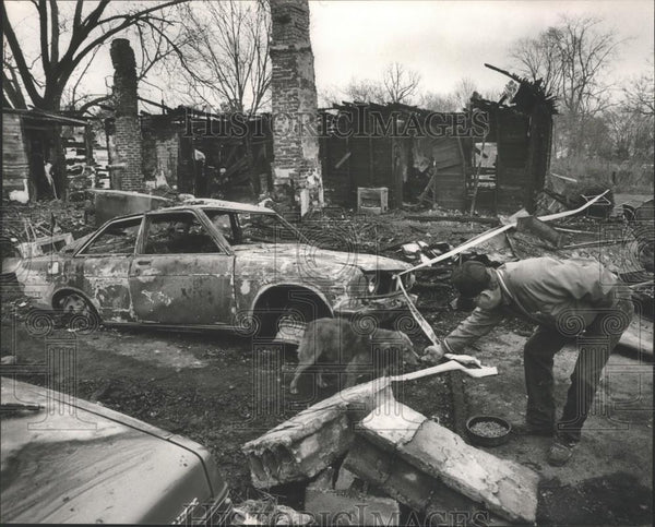 Captain Jimmy Denton Feeds Family Pet After Fire in Lipscomb, 1987 ...