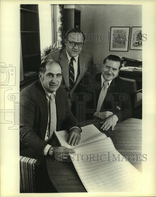 Robert Kahlor and officers shown with annual report of Journal., 1980 ...