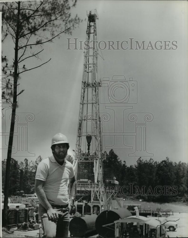 Howard, drilling foreman in front of oil rig, Shelby County, 1982 ...
