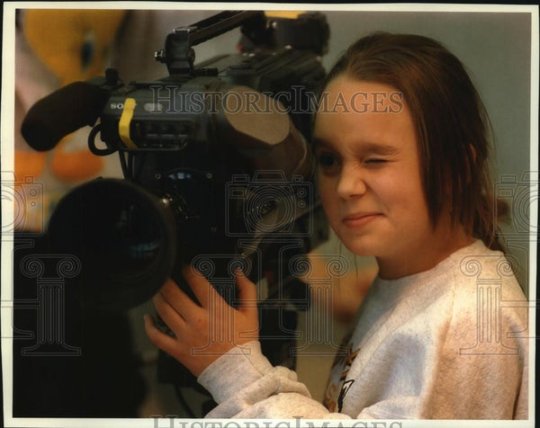 Tiffany Becker looks thru video camera at Trowbridge Elementary, 1994 ...