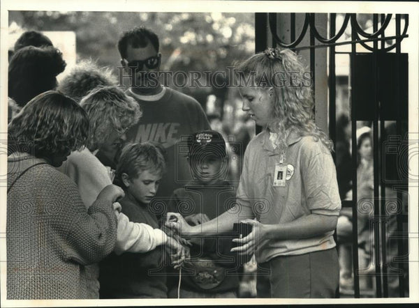 Patrice Harris stamping hands at Summerfest for free admission, 1992 ...