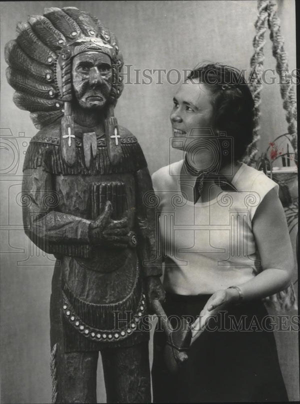 Mary Crowe of Wallace Developmental Center beside sculpture, 1978 ...