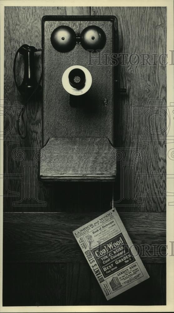 Old-fashioned telephone with phonebook, 1983 vintage press photo print ...