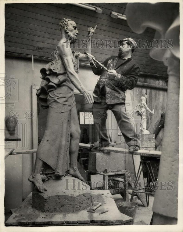 1957 Press Photo Mr. David McFall at work on his statue of St. Bride ...