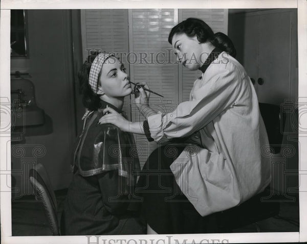 1953 Press Photo Cosmetologist Applies Makeup To Model's Face With Bru ...