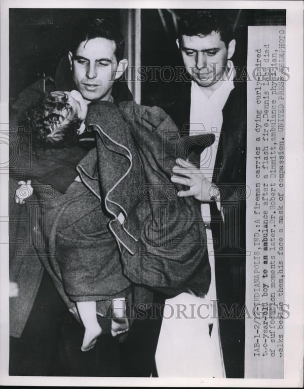 Fireman carries the critical little boy to an ambulance 1953 Vintage ...