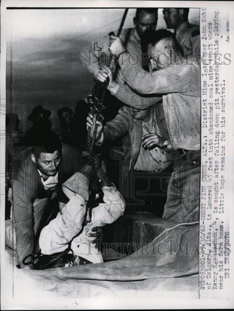 district mine inspector John Kubi being lowered into a mine. 1962 ...