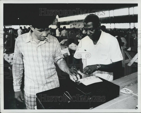 Press Photo Immigration Volunteer Helps Fingerprint Cuban Refugees ...