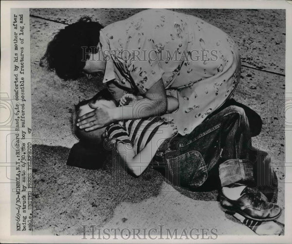 Richard Raad, 6, is comforted by his mother after being struck 1952 ...