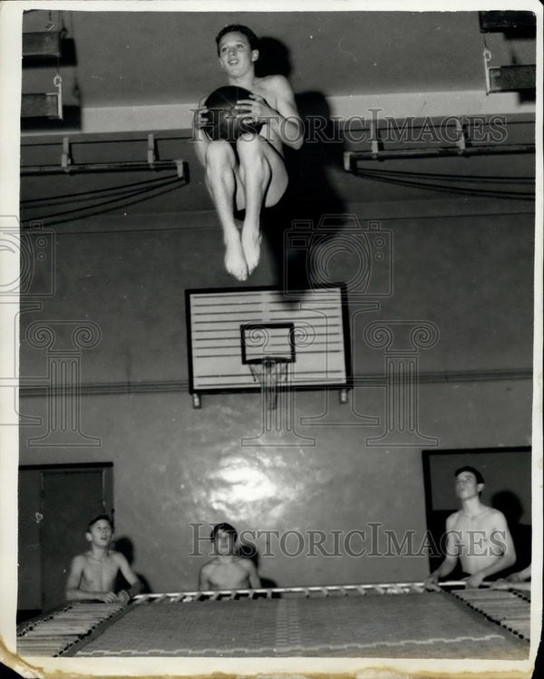 Press Photo Brian Phelps practices diving jumps on trampoline ...