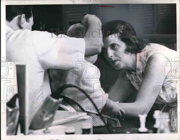 1962 Press Photo of Mrs. F.Jay Miltner and her son Bobby getting his h ...