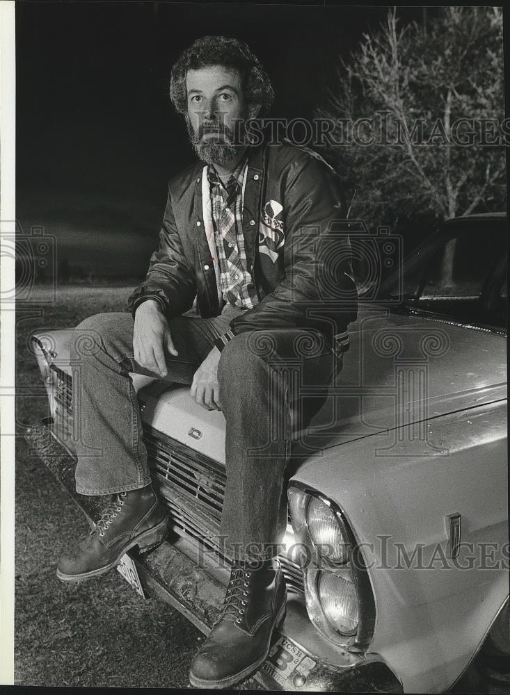 1984 Press Photo Hero Mike Howell sitting on hood of car - spa47963 ...