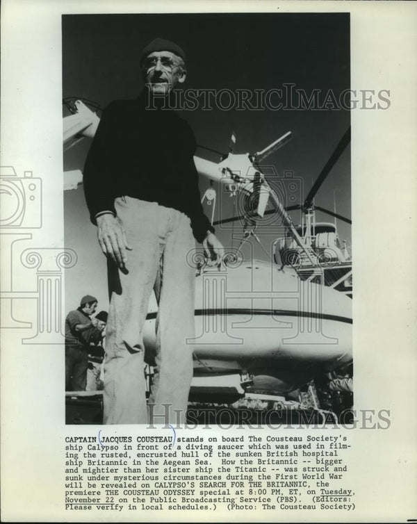 Jacques Cousteau stands aboard Calypso near film diving saucer, 1977 ...
