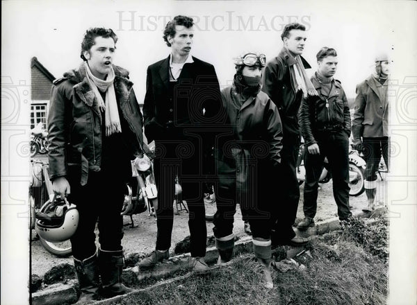 Spectators Watch Fellow Riders Speed Up And Down Road - Historic Images
