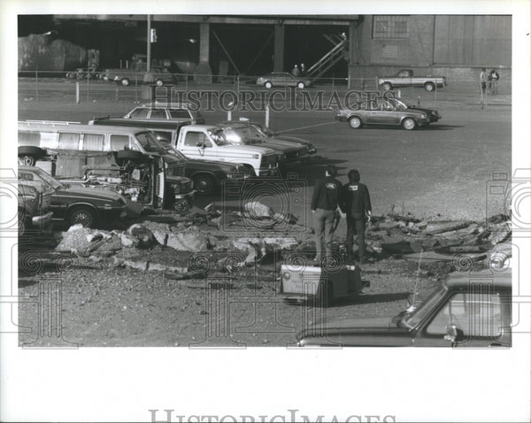 1989 Car over turned by force of explosion - Historic Images