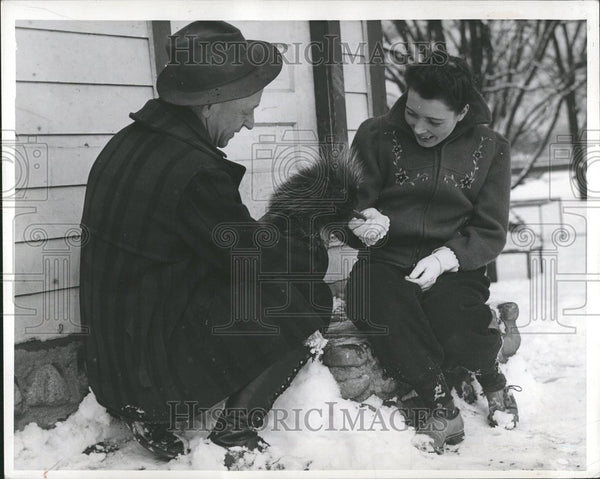 Porcupine samples a piece of candy - Historic Images