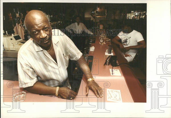 1991, Auto Dealer John Catchings Manages Bar - RRV38281 - Historic Images