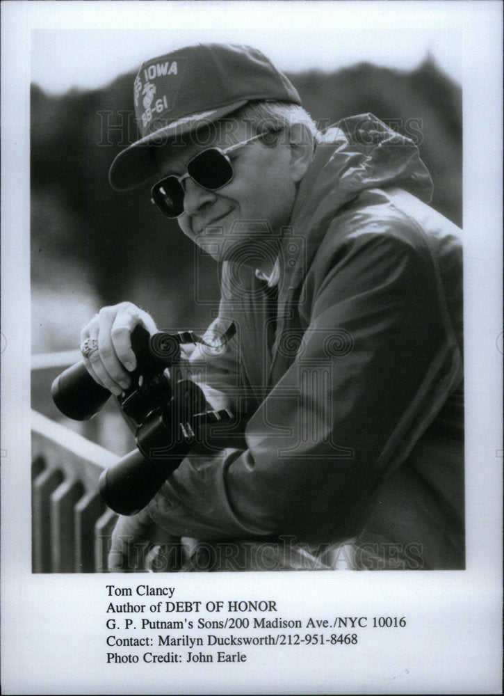 1994 Author Clancy Holding Binoculars - Historic Images